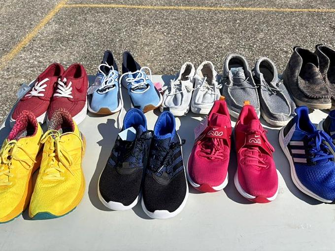 A rainbow of sneakers soaking up sunshine. Someone's barely-worn impulse buy could become your new favorite walking companions.