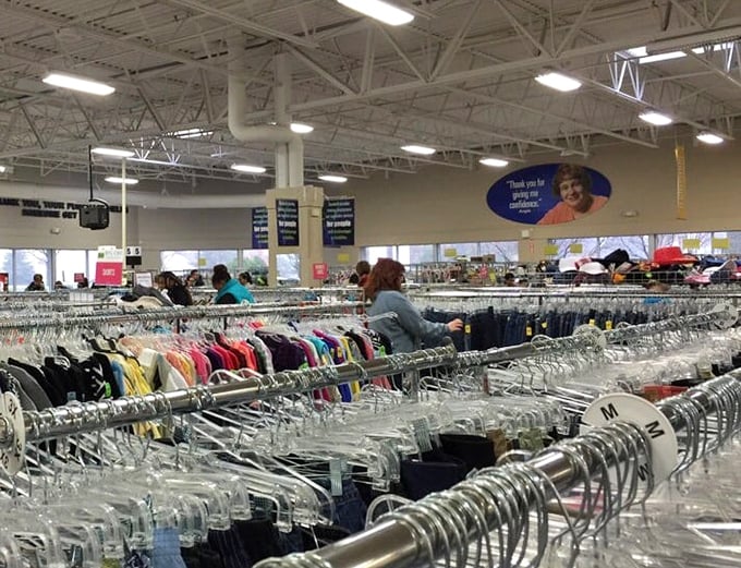 The shopping safari in full swing. Wisconsin bargain hunters navigate the clothing wilderness with practiced precision.