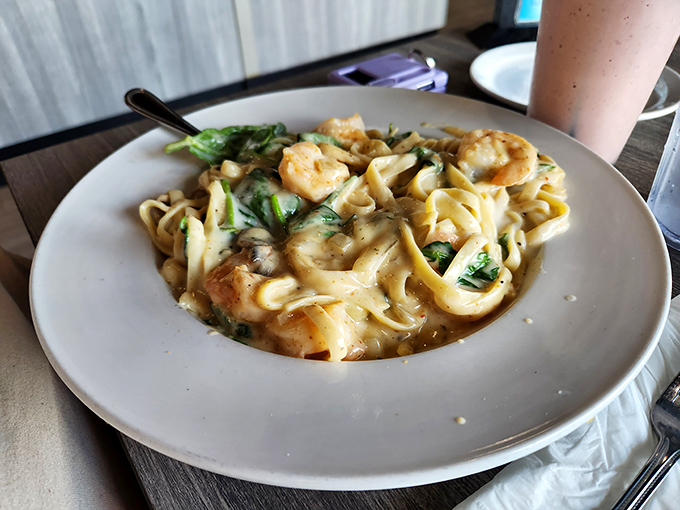 Shrimp fettuccine that would make an Italian grandmother nod in approval. Those plump shrimp nestled in creamy pasta are practically doing the backstroke.