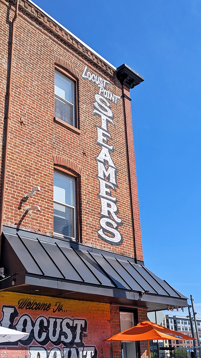 The vertical "STEAMERS" sign against a brilliant blue sky—a siren call to seafood lovers that's visible from blocks away.