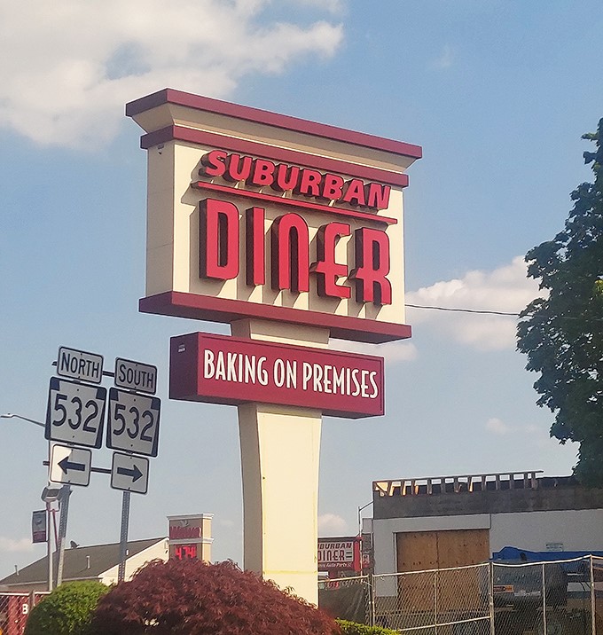 That classic neon sign beckons hungry travelers like a lighthouse guiding ships to safe harbor. Follow it to breakfast bliss!