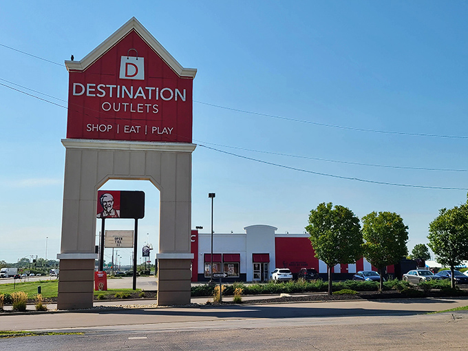 The Destination Outlets sign towers above the landscape like a retail lighthouse guiding bargain-seekers safely to shore.
