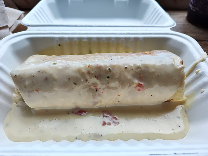 This skirt steak burrito swimming in queso is what comfort food dreams are made of&mdash;no pillow required.