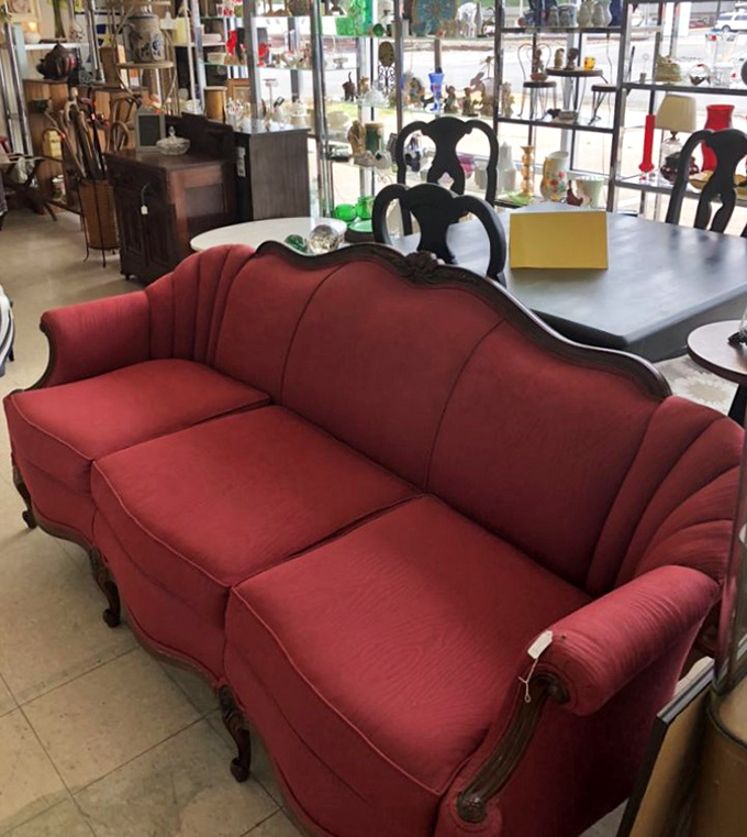 That crimson sofa isn't just furniture&mdash;it's a statement piece that's witnessed decades of life's dramas before landing here for its second act.