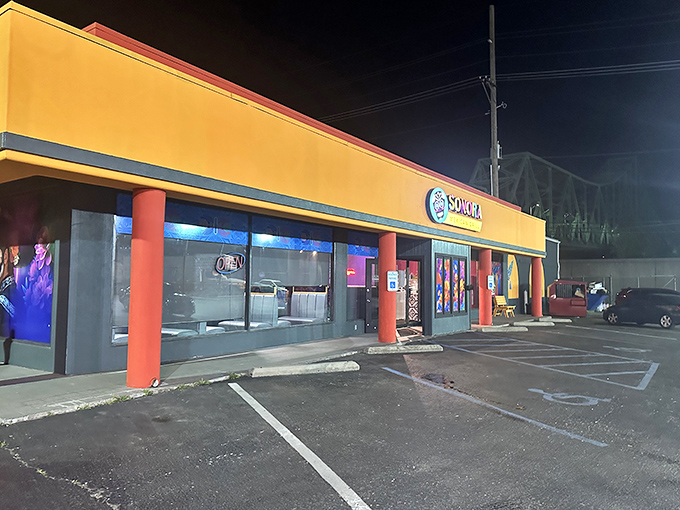 Sonora Mexican Grill's bold yellow exterior stands out against the night sky – a beacon of salsa and satisfaction for hungry Ashland residents.