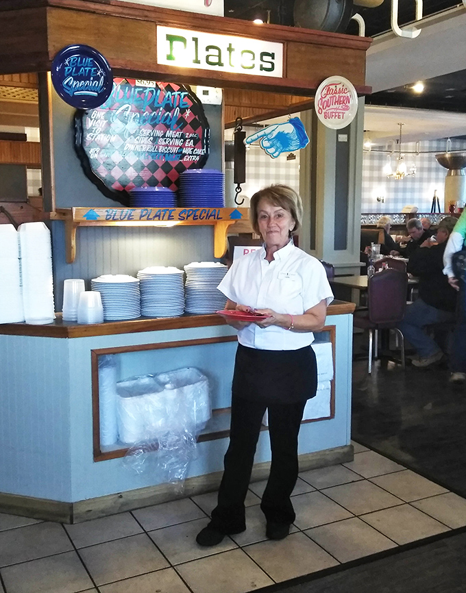 The unsung heroes of breakfast stand ready at the buffet line, where plates are filled and happiness is served.