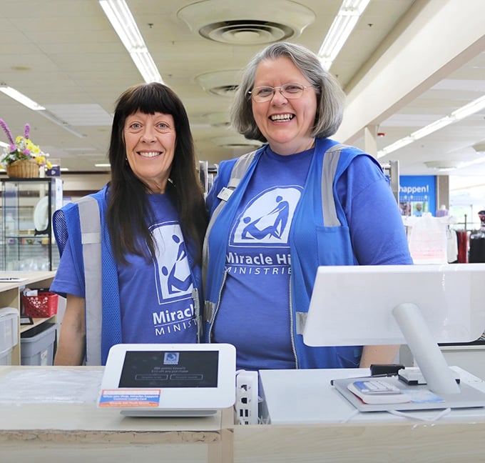 The smiling faces behind Miracle Hill's mission wear their purpose proudly, turning your treasure hunting into community support with every purchase.
