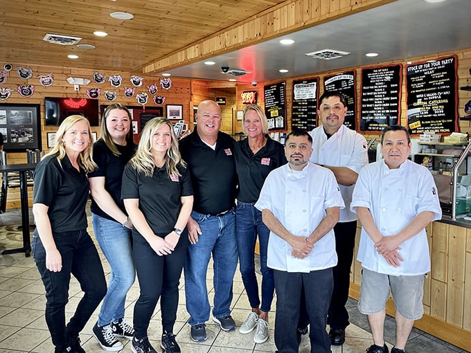 The team behind the smoke. These BBQ artisans don't wear capes, but they should.