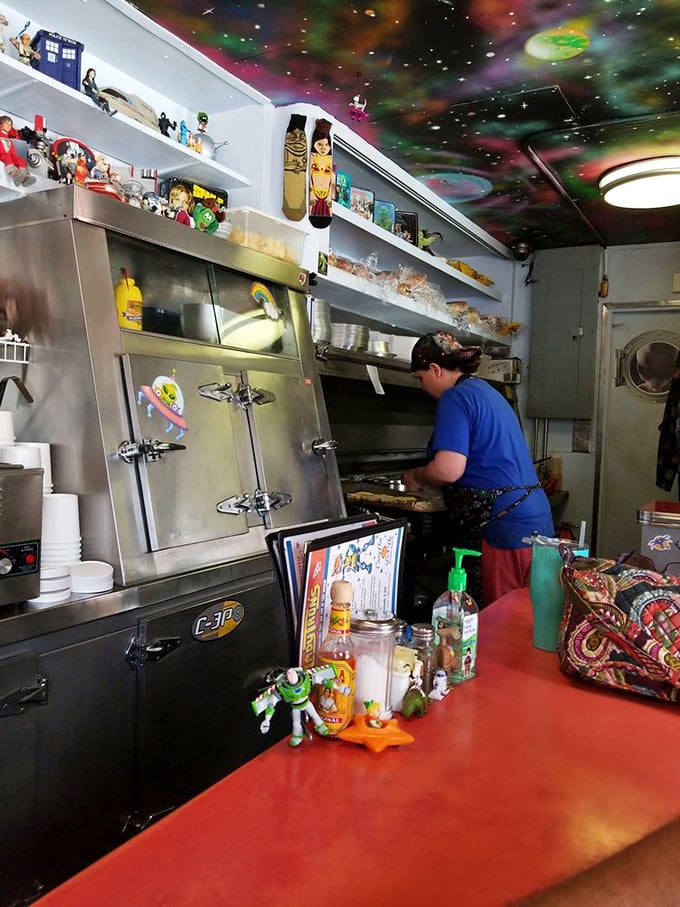 Behind the scenes in Lady Tron's kitchen, where sci-fi dreams and sandwich realities collide under a ceiling of painted stars.