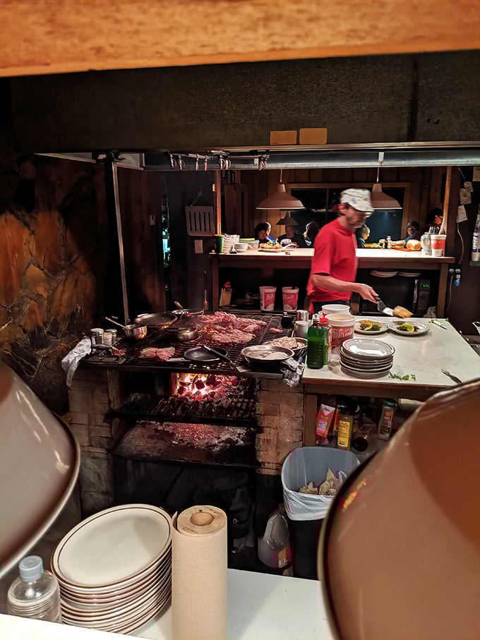 Culinary choreography in action – the kitchen staff moves with practiced precision, transforming raw ingredients into edible art.