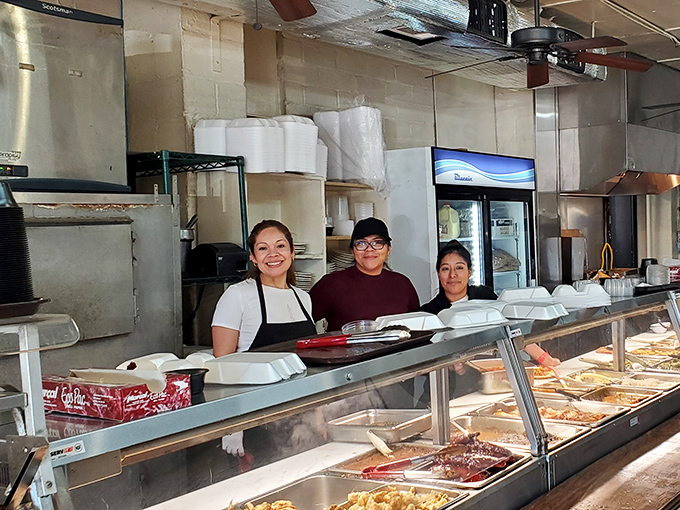 The serving line where magic happens daily—staffed by people who know exactly how much gravy constitutes "a little extra" when you ask.