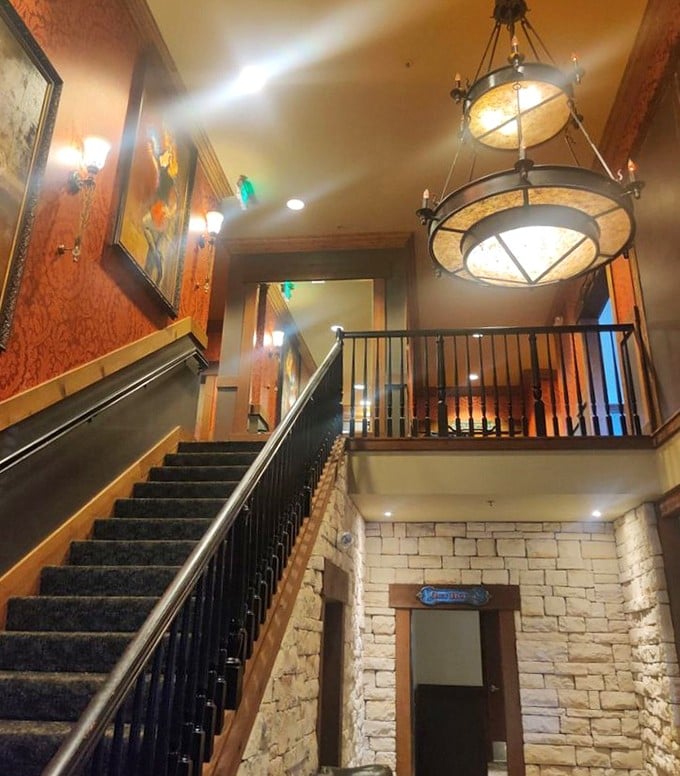 This stairway doesn't just lead upstairs&mdash;it's a portal to a second floor of Texas-sized hospitality under those magnificent wagon wheel chandeliers.