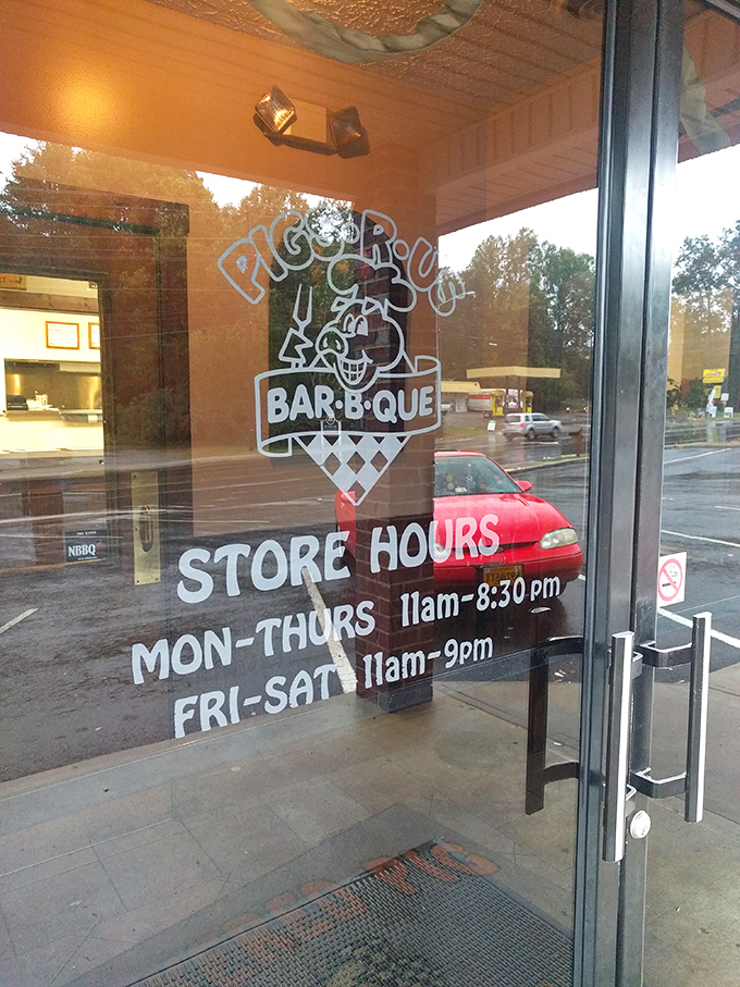 Store hours posted like a public service announcement for when happiness is available.