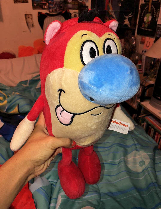 This grinning red character isn't just a stuffed toy; it's a portal to someone's childhood memories, now available for adoption.