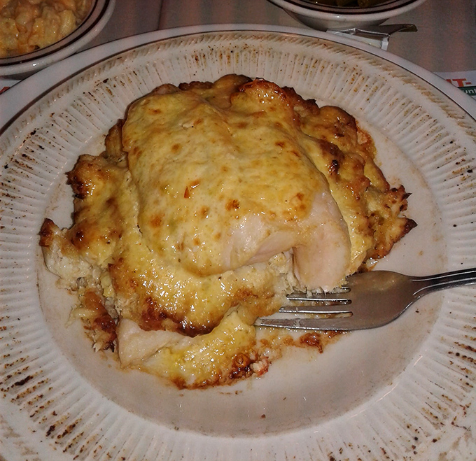 Seafood gets the royal treatment under a golden crown of cheese that's been kissed by fire and blessed by butter.