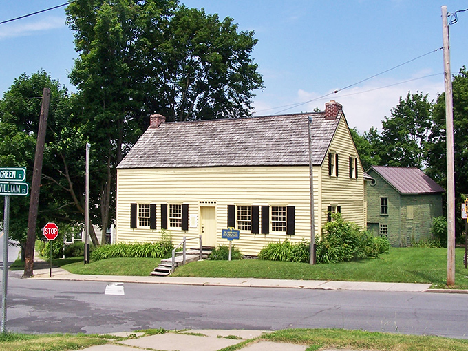 The Drumm House sits at the intersection of history and charm, a yellow colonial reminder that good architecture never goes out of style.