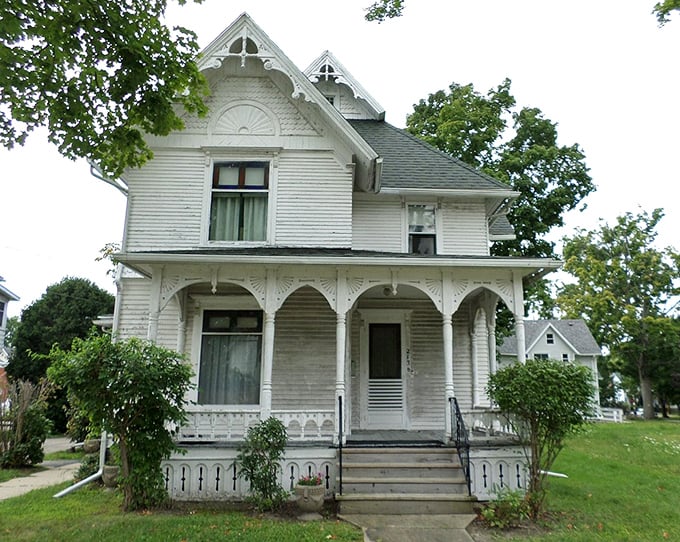 The George Perrigo House's delicate white trim and welcoming porch whisper stories from another century.