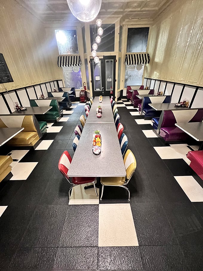 The diner's retro interior feels like stepping into a Technicolor time capsule, where every colorful chair promises comfort and conversation.