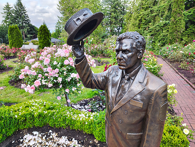 Tipping his hat to Portland's floral heritage. This dapper bronze gentleman stands guard over his beloved roses with eternal vigilance.