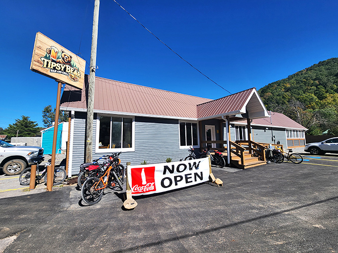 The Tipsy Bear's "Now Open" sign might be the happiest sight for thirsty hikers coming off the trail, promising cold drinks and warm camaraderie.