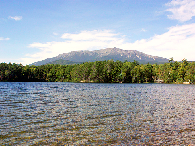 Mount Katahdin stands majestically across Togue Pond like nature's own monument. Maine's highest peak practically poses for postcards all day long.