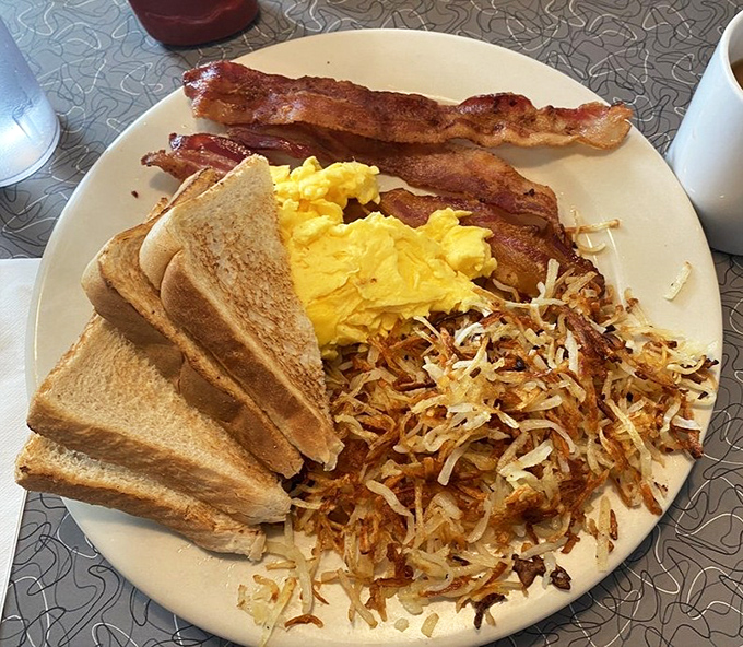 The breakfast plate that answers the eternal question: "Why choose one delicious thing when you can have three?" Pure morning bliss
