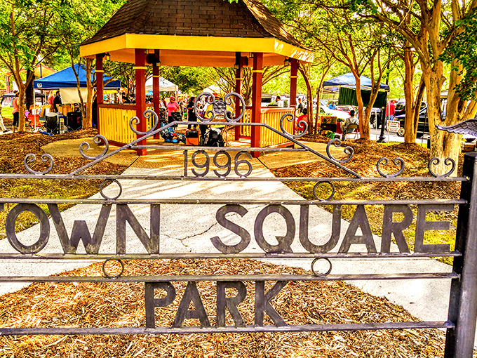 Town Square Park serves as community gathering space where actual human interaction still occurs without smartphone mediation required.