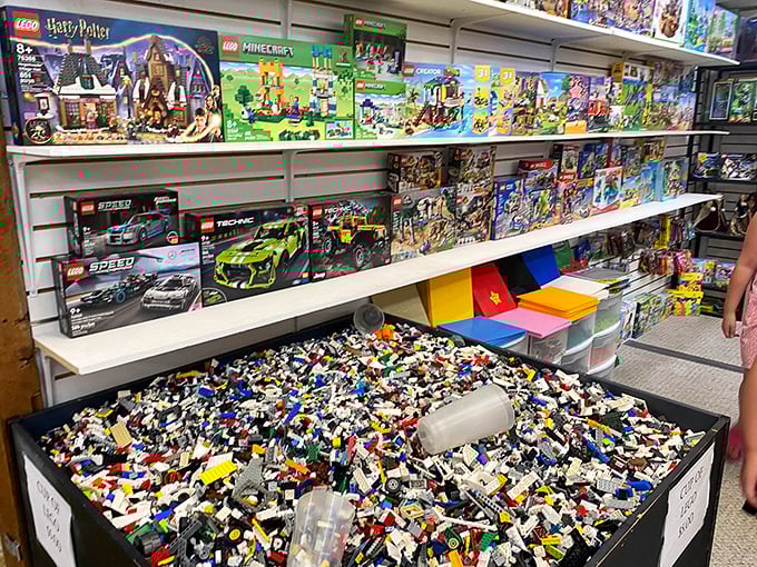LEGO paradise! Boxed sets line the walls while a treasure trove of loose bricks below invites builders to dig for that one perfect piece.