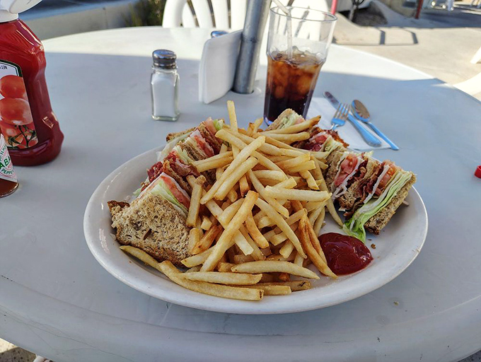 The classic club sandwich&mdash;triple-decker architecture that proves sometimes the best things in life come stacked, just like the records on a diner jukebox.