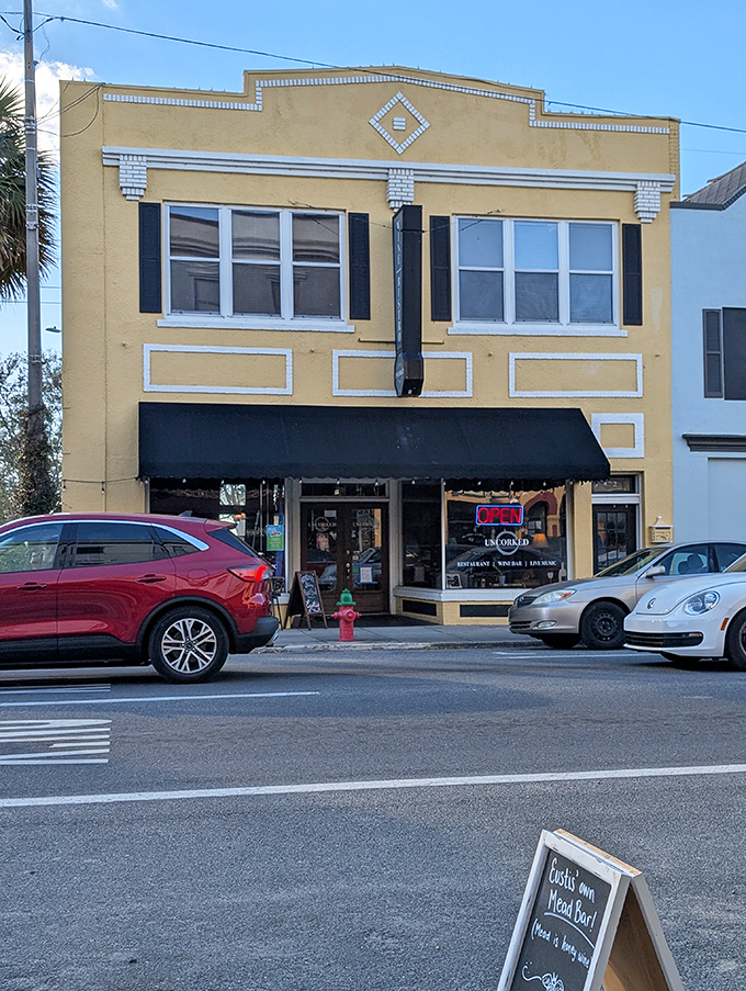 This cheerful yellow building houses local treasures, proving that sometimes the best discoveries come in storefronts that wouldn't look out of place in a Wes Anderson film.