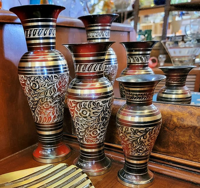 Metalwork masterpieces from Kuwait line up like beauty pageant contestants. These hand-etched vases bring global artistry to Wyoming homes.