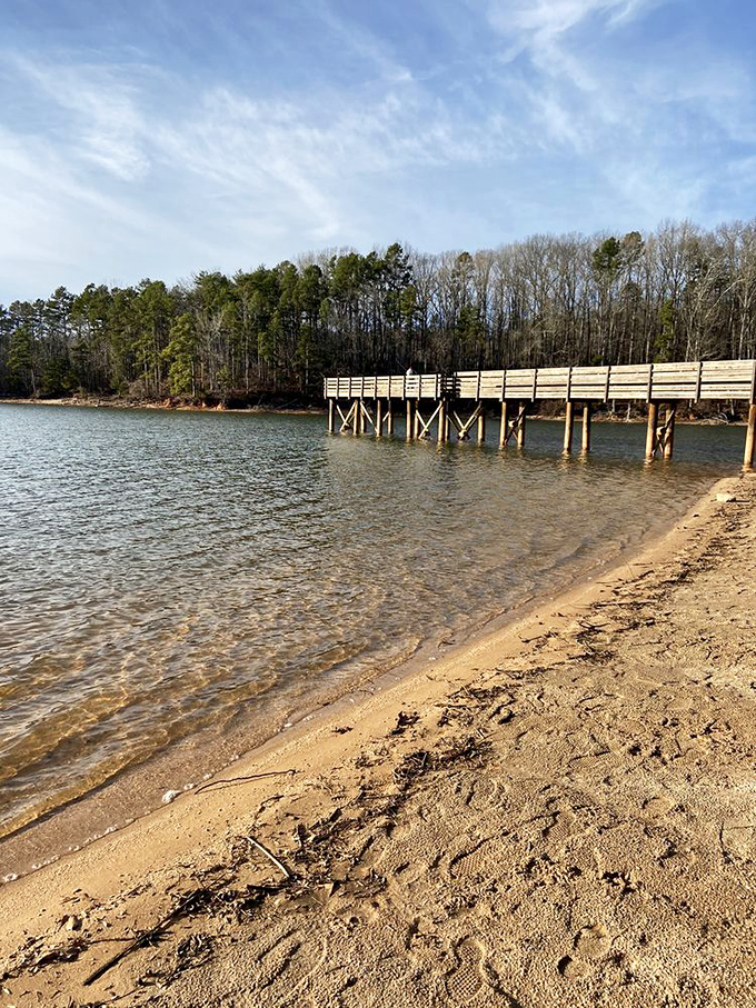 Sandy shores meet crystal waters at this hidden beach, where footprints tell stories of summer adventures and quiet contemplation.