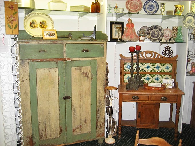 This mint-green cabinet has seen more history than your high school textbook and still has better stories to tell. 