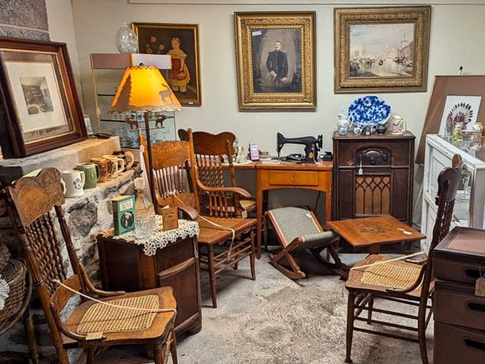 This cozy corner vignette feels like your grandmother's parlor, if grandma had impeccable taste in antique furniture and framed portraits.