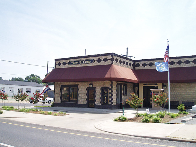 The Visitor Center stands ready to welcome travelers, its brick pattern playing a visual jazz that says "Louisiana" without saying a word.