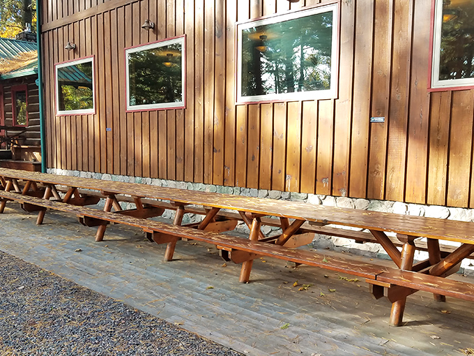 Outdoor seating that invites lingering conversations &ndash; picnic tables waiting patiently for summer evenings and the clinking of cold beverages.