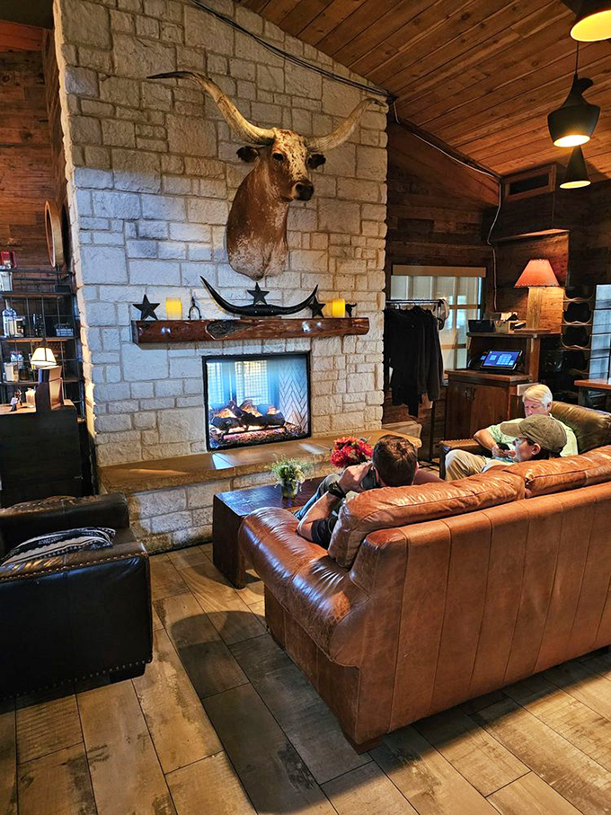 Even the waiting area feels like a cozy living room, complete with fireplace and longhorn watching over guests.