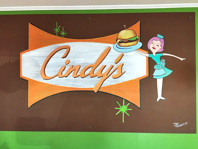 Mid-century modern meets breakfast joint in this playful wall art. The cartoon waitress seems to be saying, "Yes, you definitely need those pancakes."