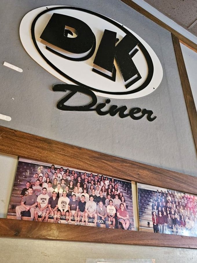 The DK Diner sign watches over vintage Grandview High photos&mdash;a reminder that this place isn't just serving food, but preserving community history.