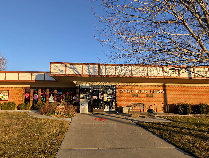 The public library hosts decorated windows that suggest someone here understands community gathering spaces still matter in the digital age.