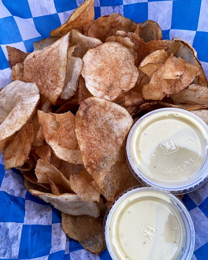 The legendary Whale Fries arrive like crispy potato postcards from heaven, accompanied by the mysterious "whale juice" that you'll be dreaming about for weeks.