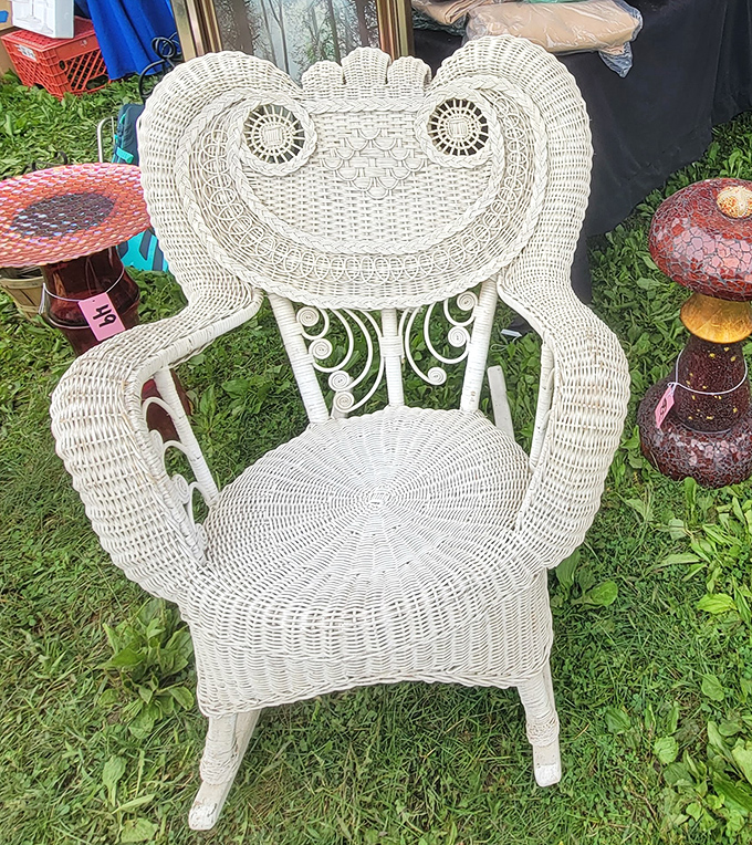 The throne of flea market royalty. This white wicker chair isn't just furniture&mdash;it's a statement piece with personality.