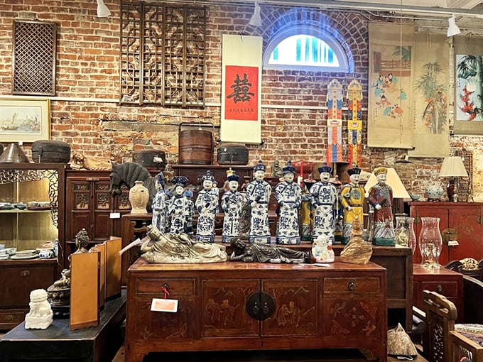 An entire wall becomes a gallery where Chinese calligraphy meets carved wood and porcelain guardians&mdash;museum-quality displays at take-home prices.