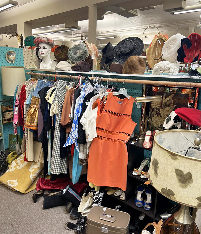 Vintage fashion displayed with theatrical flair. That bright orange dress is ready for its second act at your next summer soir&eacute;e.