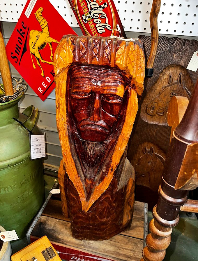 This wooden tribal face carving isn't judging your decorating choices, but it will definitely become the conversation piece in your living room.