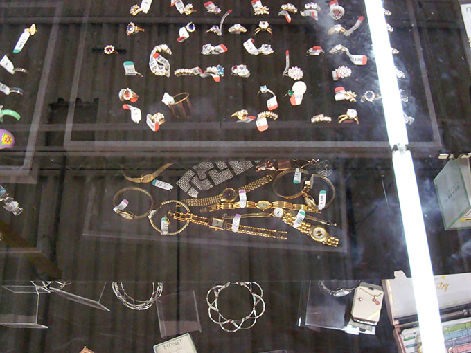 Jewelry case treasures that whisper tales of previous celebrations. Someone's special occasion sparkle awaits its second chance to shine.