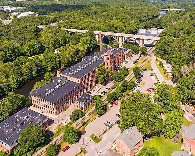 This aerial view reveals Cumberland's perfect balancing act: historic mills, verdant forests, and the river that ties it all together.