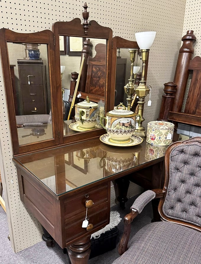 This vanity has reflected generations of faces and fashion choices. Its drawers once held secrets, lipsticks, and perhaps a love letter or two.