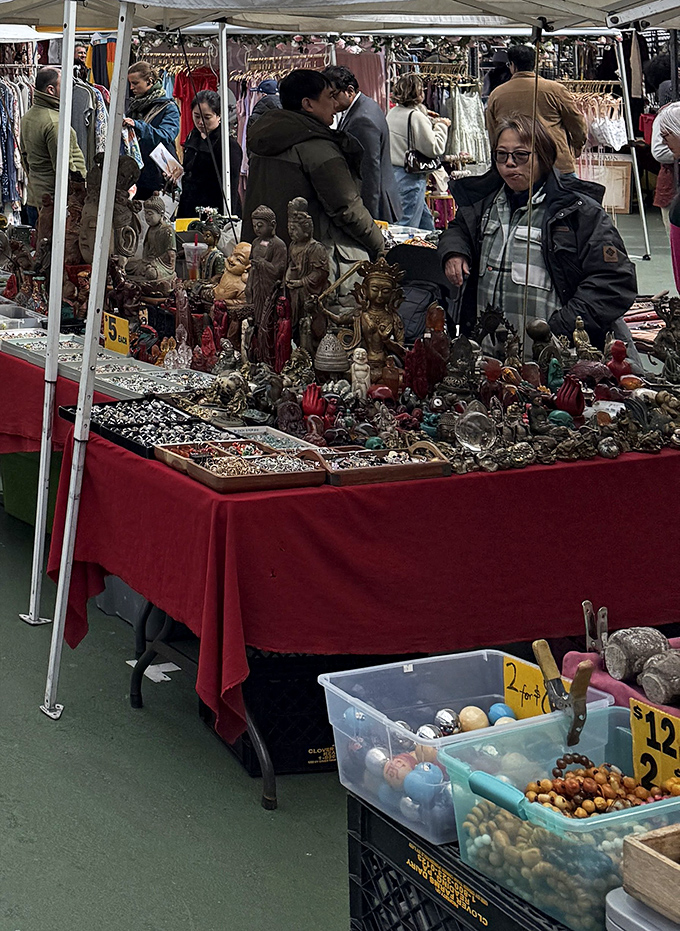 Buddha statues and spiritual trinkets create a zen marketplace moment. Enlightenment available for purchase, no mountain-climbing or lotus position required.