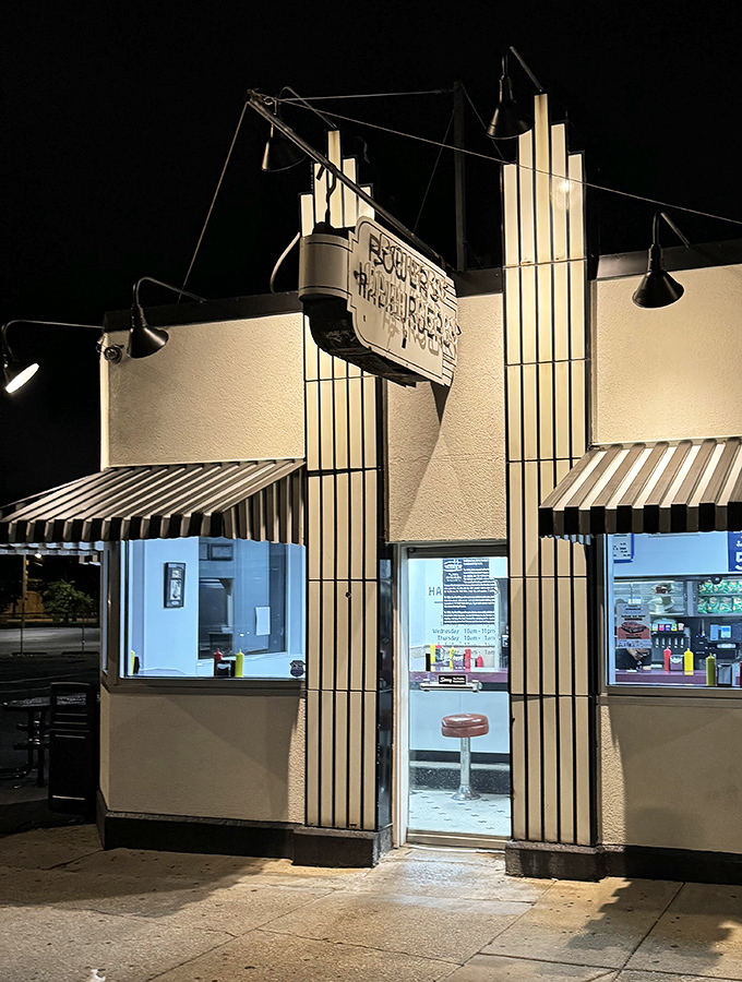 At night, Powers transforms into a beacon of hope for the hungry, its neon glow promising satisfaction just steps away.